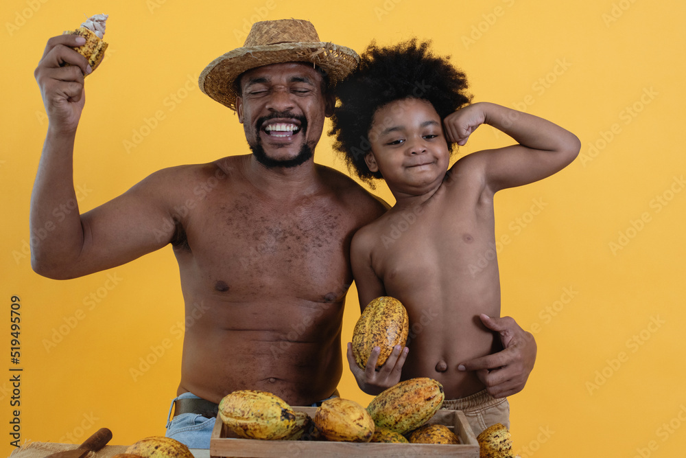 African father and son shirtless to show off their muscles.on yellow ...