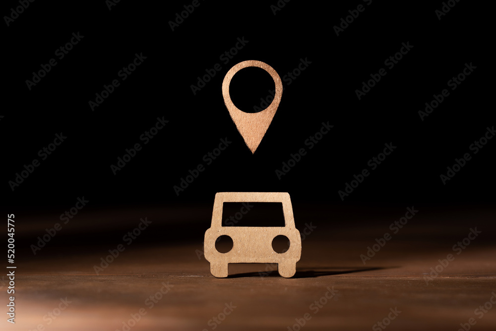 Cardboard representation of a car with the symbol of position on the ...