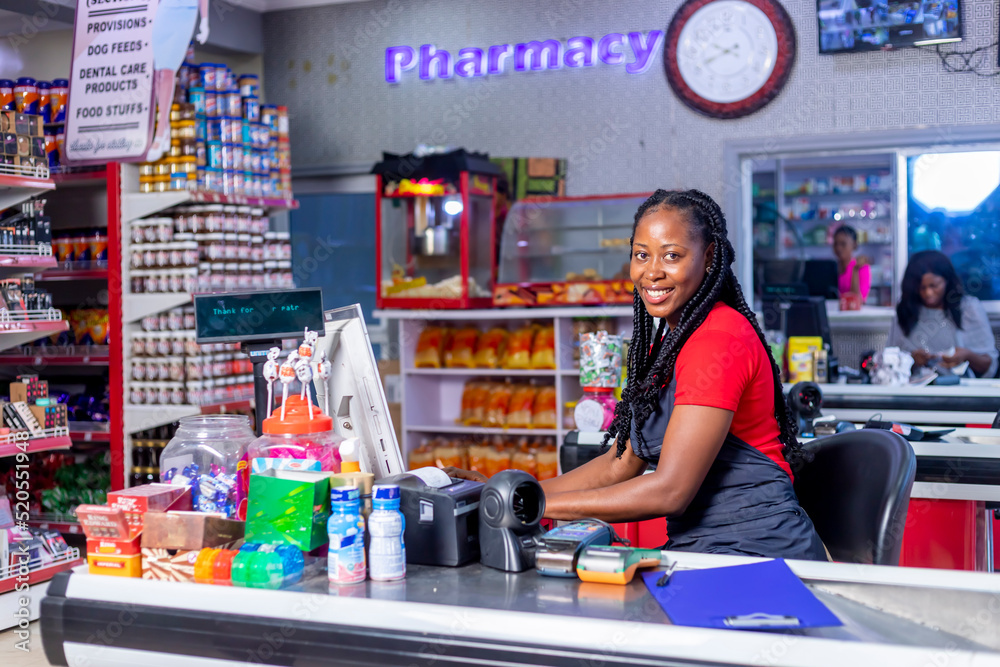 young African American millennial Woman cashier at supermarket. female ...