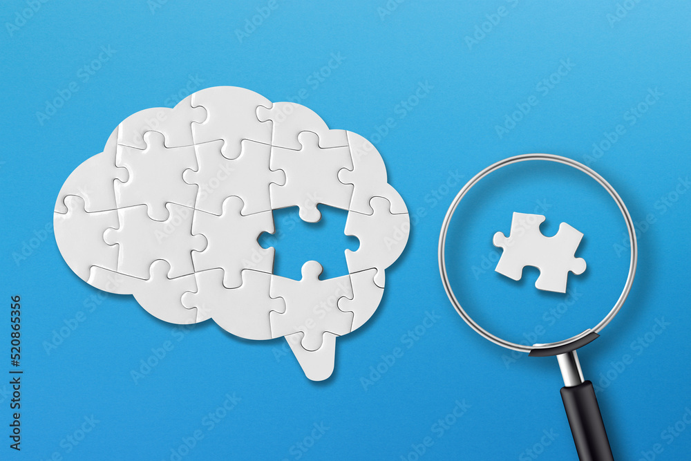 Brain shaped white jigsaw puzzle on blue background. Searching missing ...