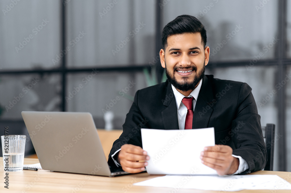 Positive handsome confident arabian or indian successful businessman ...