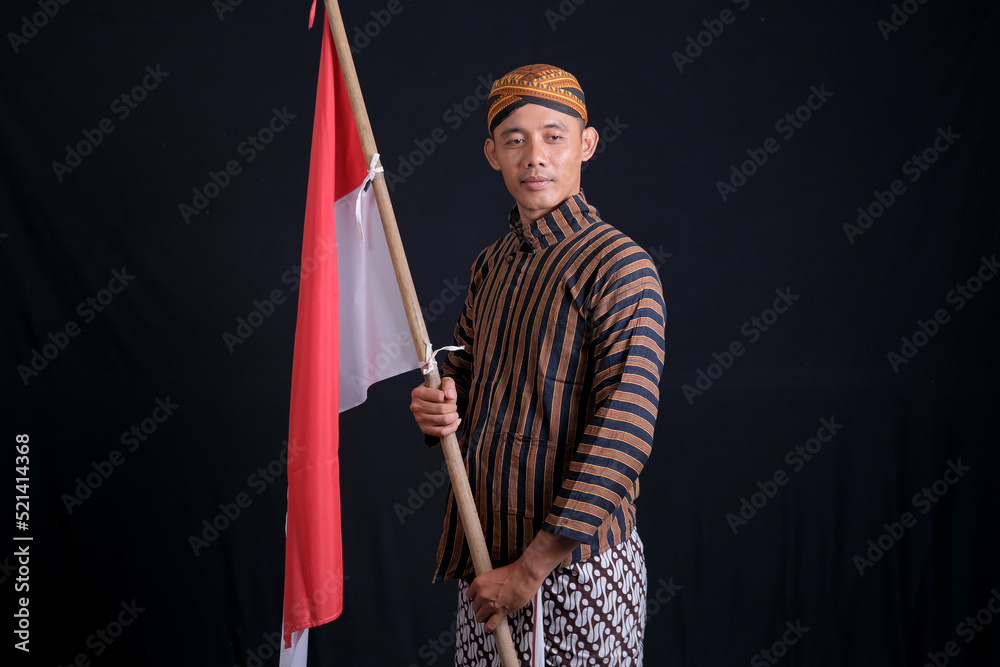 Men wearing traditional Javanese batik clothes to show the richness of ...