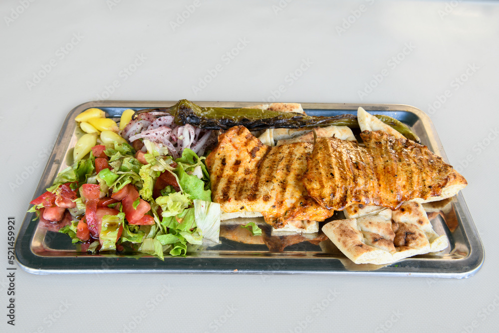 Chicken wings barbeque in a dish with BBQ grill sauce . Izgara tavuk ...