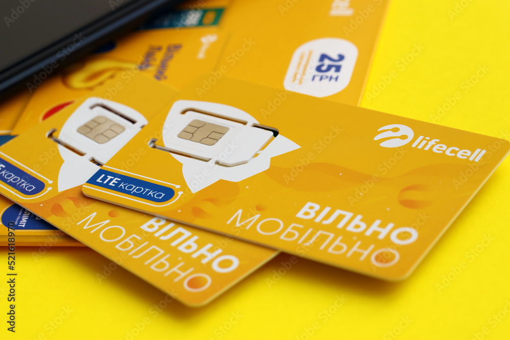 TERNOPIL, UKRAINE - JULY 5, 2022: Lifecell new sim card with free contract on yellow background ...