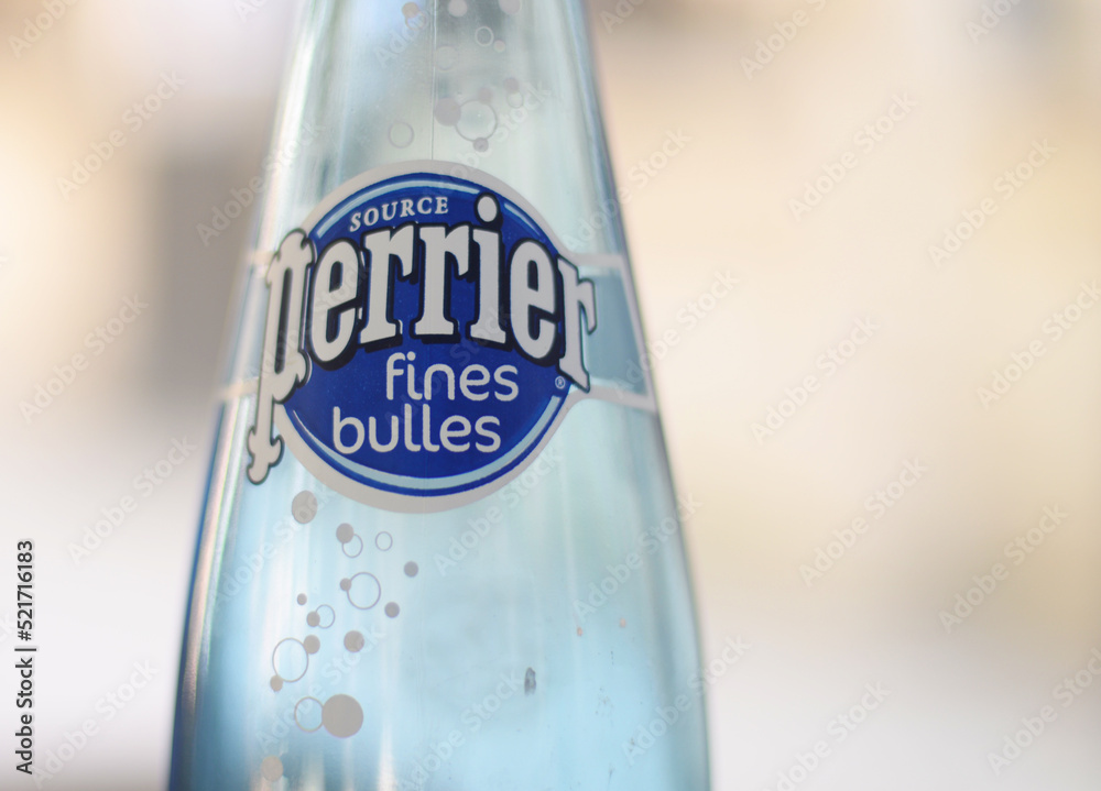 ROUEN, FRANCE – AUGUST 3 2022: Blue plastic bottle of Eau de Perrier, a ...