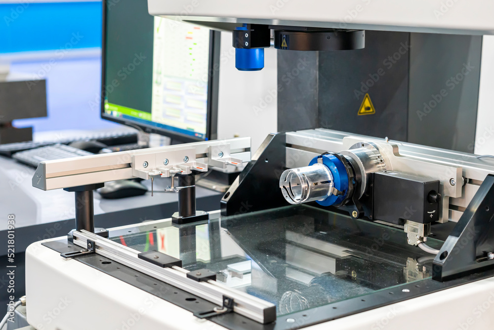 Metal workpiece during measuring by high technology and precision optic ...
