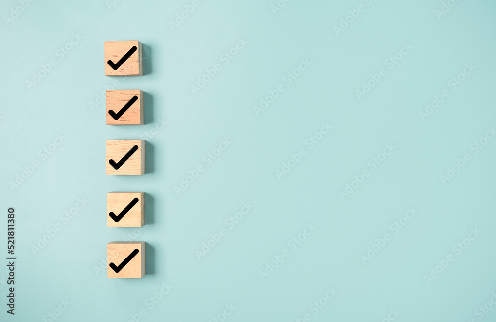 Black correct sign and tick check mark to wooden cube block with copy ...