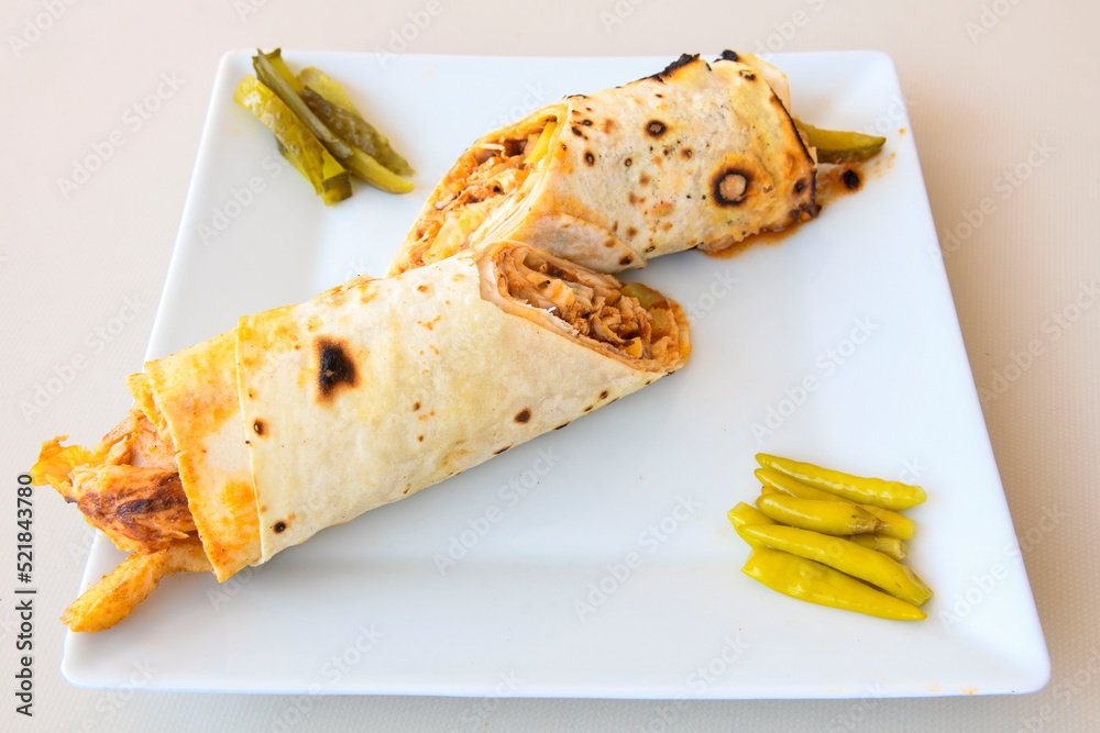 Lavash doner kebab ( zurna doner durum ) or shawarma sliced in plate ...