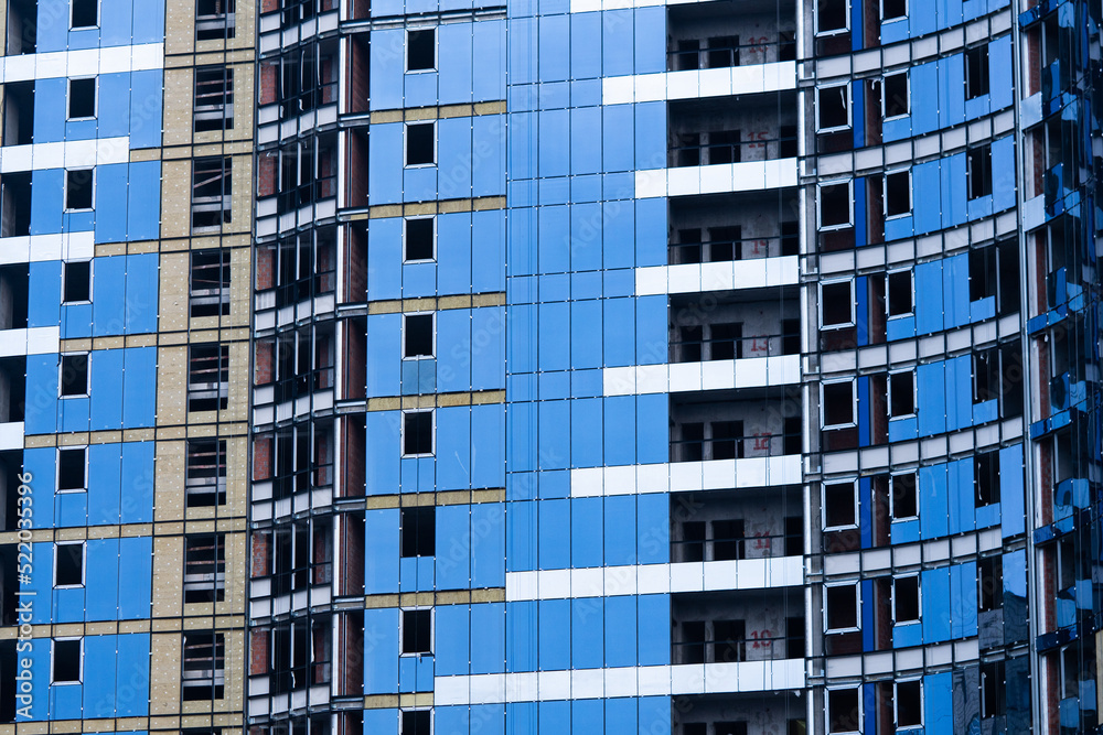 Facing the building with a ventilated facade. Aluminum colored facades ...