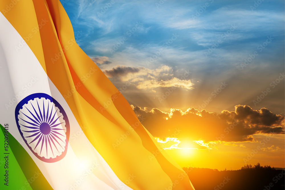 Waving India flag on sunset sky. Background with place for your text ...
