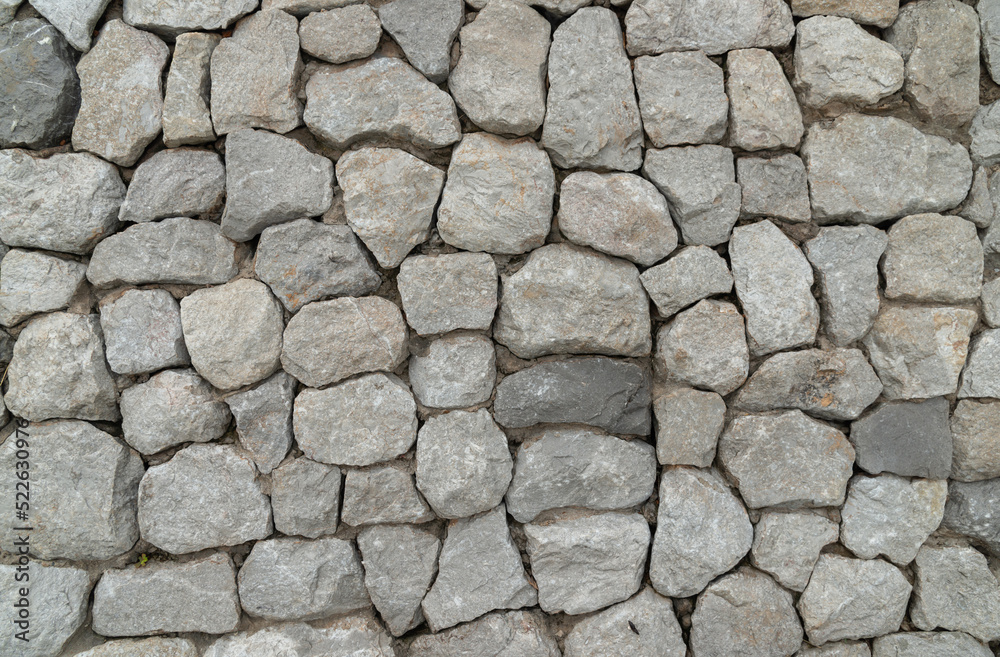 Neatly stacked rough cut stone wall seamless texture background. Stock ...