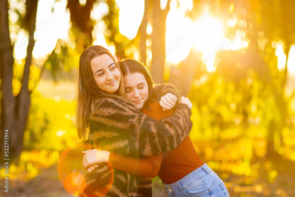 teenage girl comforting her friend with a hug Stock Photo | Adobe Stock