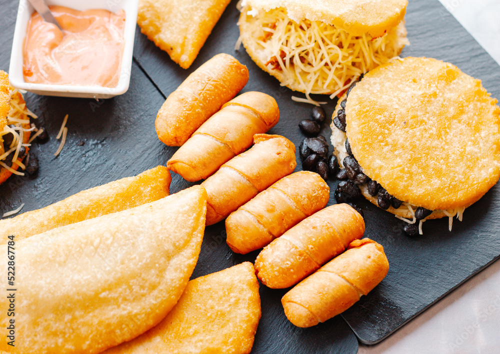 traditional Venezuelan food, fried arepas, empanadas and tequenos Stock ...