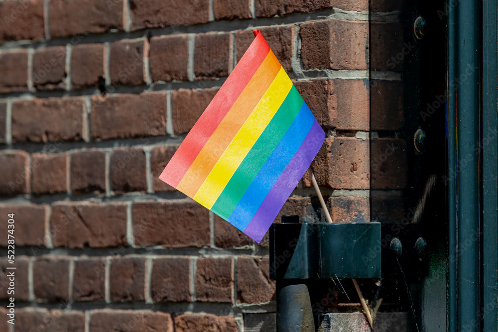 Celebration of pride month in Amsterdam, Rainbow flags hanging outside ...