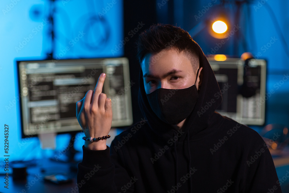 cybercrime, hacking and technology concept - hacker wearing black mask ...
