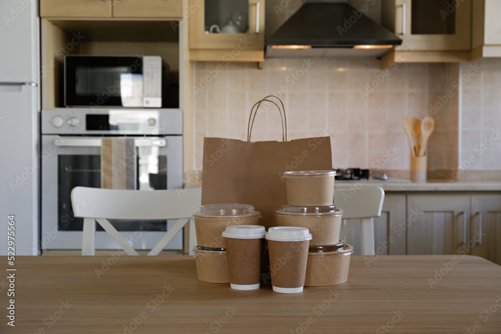 Bunch of blank disposable containers for takeout food stacked with ...