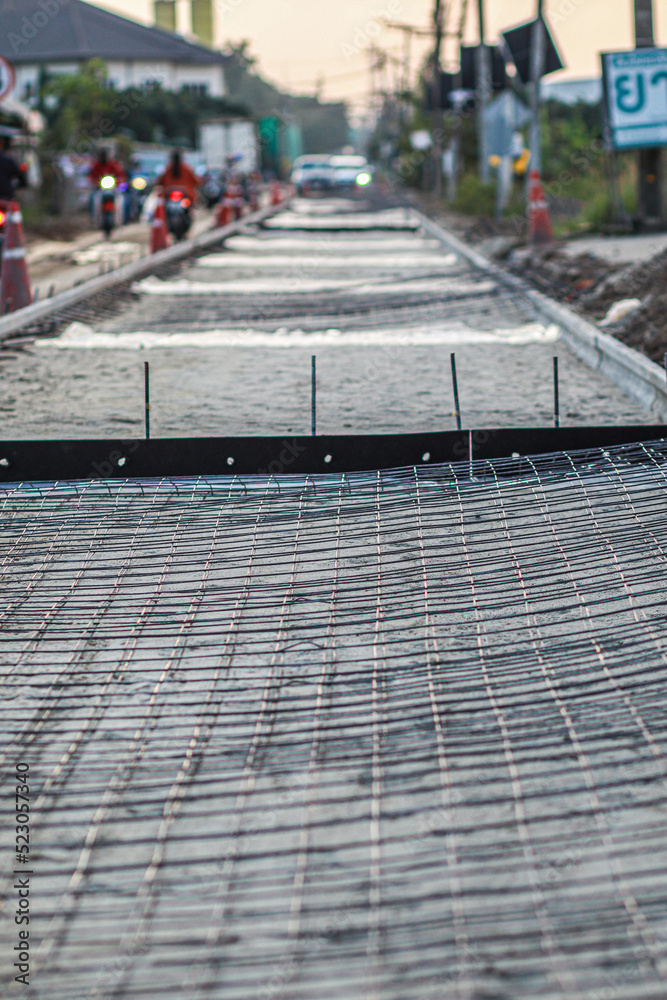 Steel gratings are placed on the roadway in preparation for the ...
