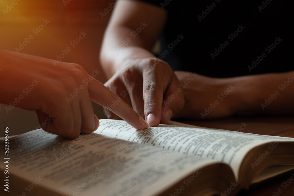Christian friends group reading and study bible together in home or ...