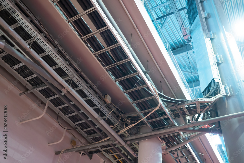 Tangled wires. Lots of wires under ceiling. Steel channels for ...