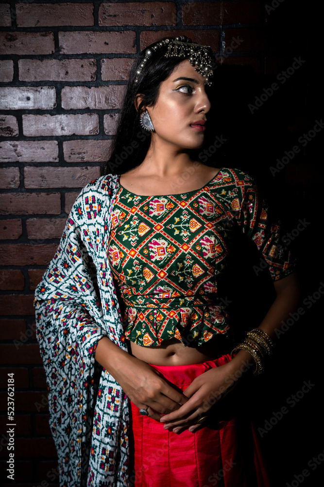 Beautiful Indian woman in traditional chaniya choli for navratri ...