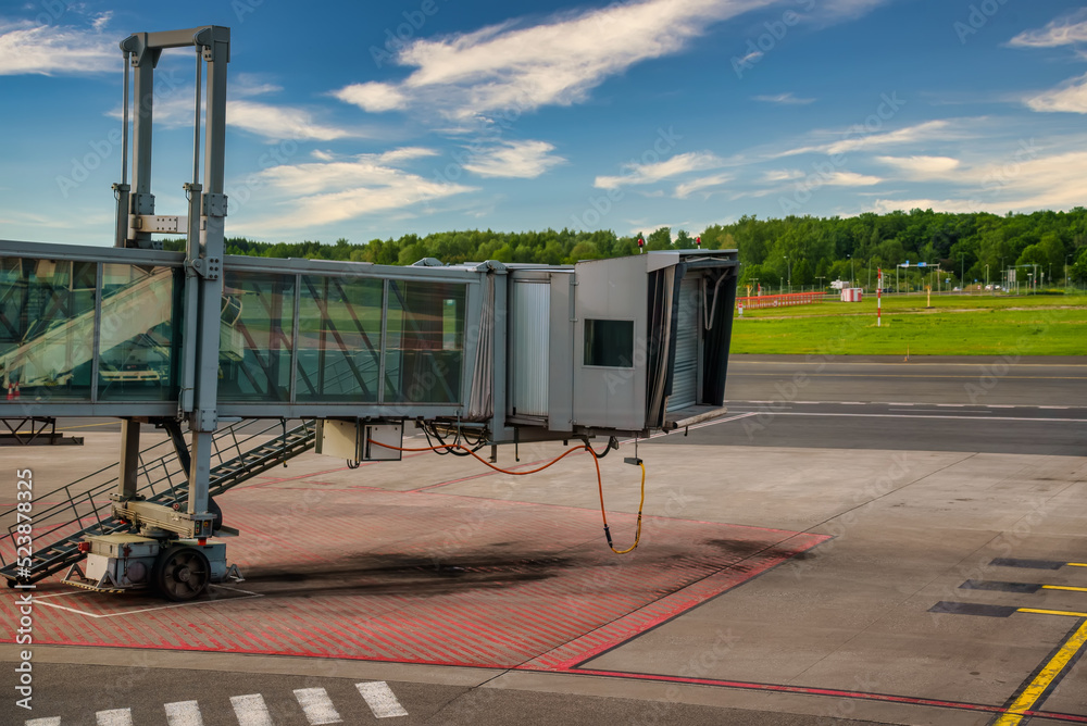 Jet bridge from an airport terminal gate. Stock Photo | Adobe Stock