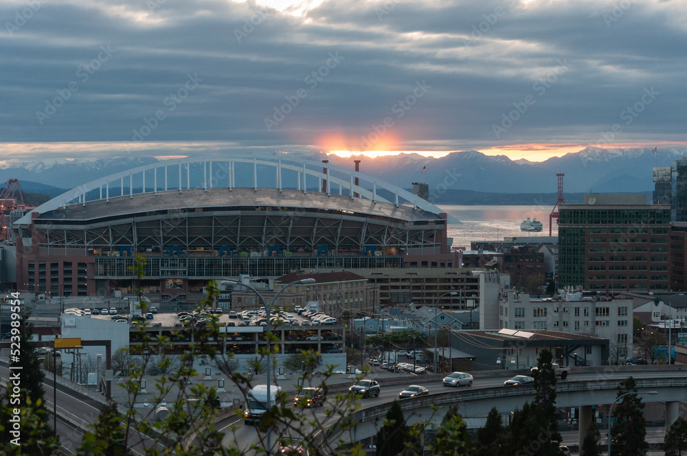 Sunset over Centurylink field stadium, two ferries in Puget Sound and ...