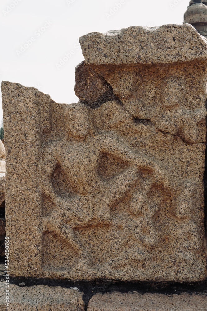 Bas relief rock cut sculptures of gods, people and animals are carved prominently in the ...