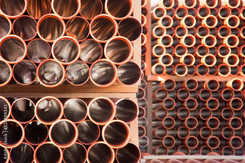Background of orange plastic sewage pipes used at the building site ...
