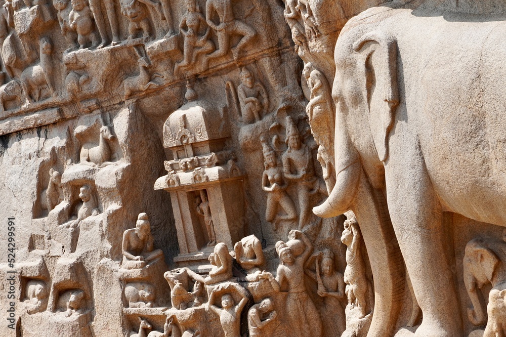 Bas relief rock cut sculptures of gods, people and animals are carved ...