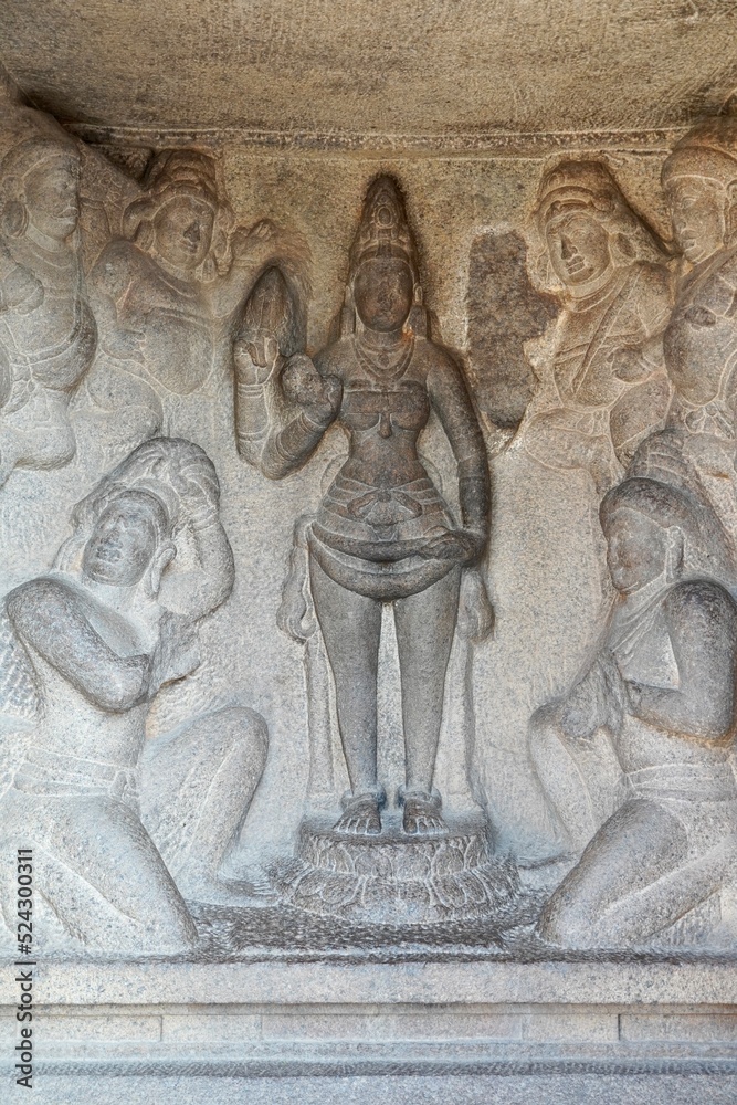 Bas relief rock cut sculptures of gods, people and animals are carved prominently in the ...