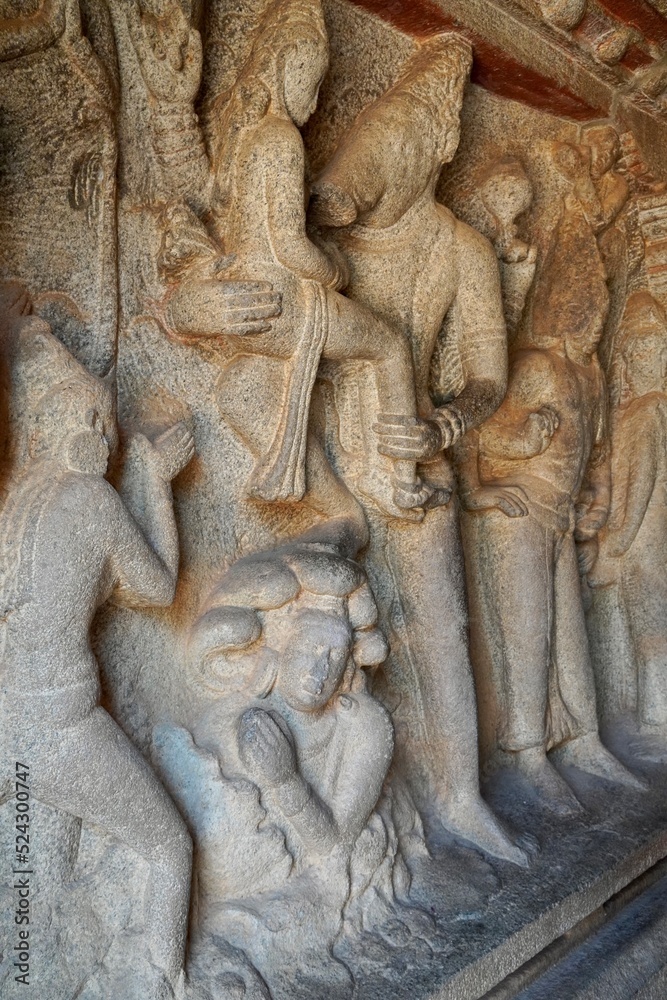 Bas relief rock cut sculptures of gods, people and animals are carved prominently in the ...