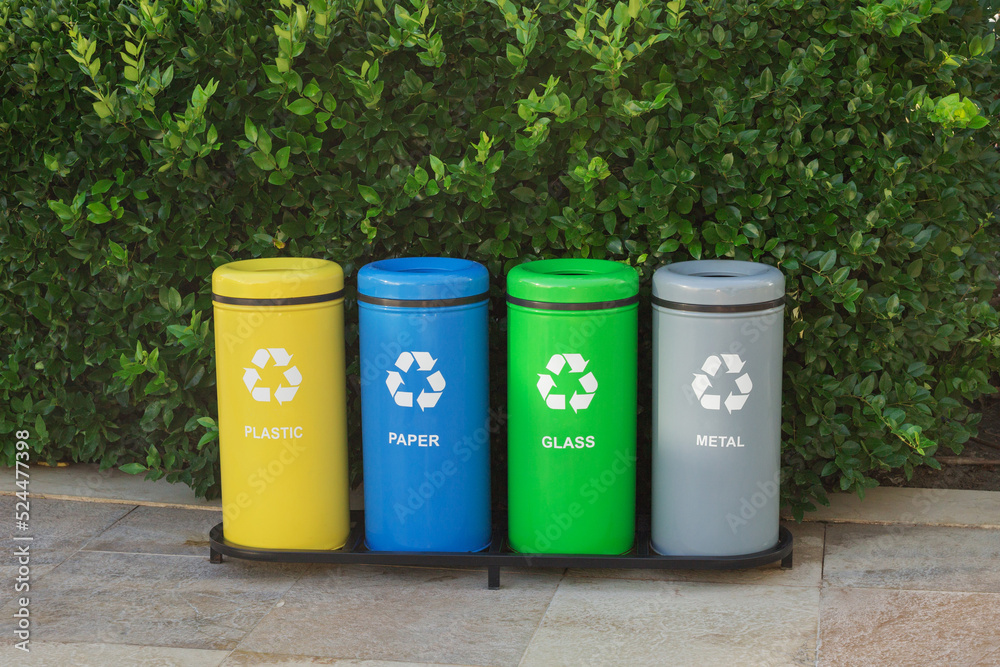 Colorful trash bins for waste segregation. (plastic, paper, metal, glass). Separate waste ...