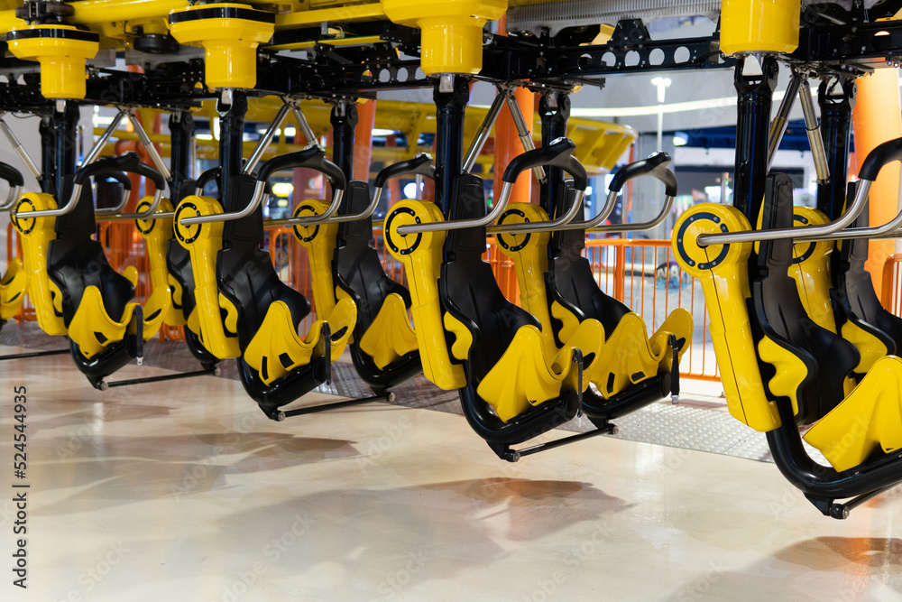 Roller coaster with empty seat parking inside the station in the ...