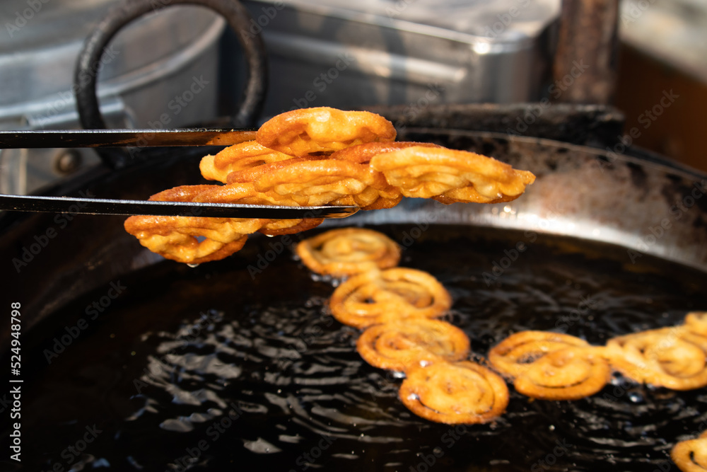 Holding Deep Fried Indian Jalebi Also Known As Jilapi, Jilebi, Jilipi ...