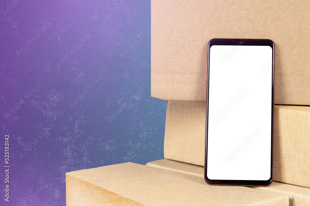 Mock up phone. Smartphone on cardboard boxes. Cellphone fo storage ads ...