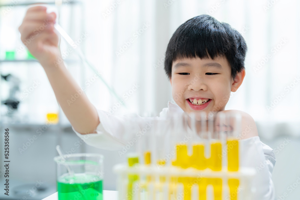 Young Asia kid doing experiment with foreigner teacher in the ...