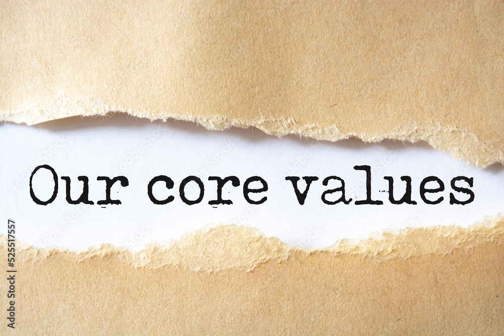 Our core values symbol. Words 'Our core values' appearing behind torn ...