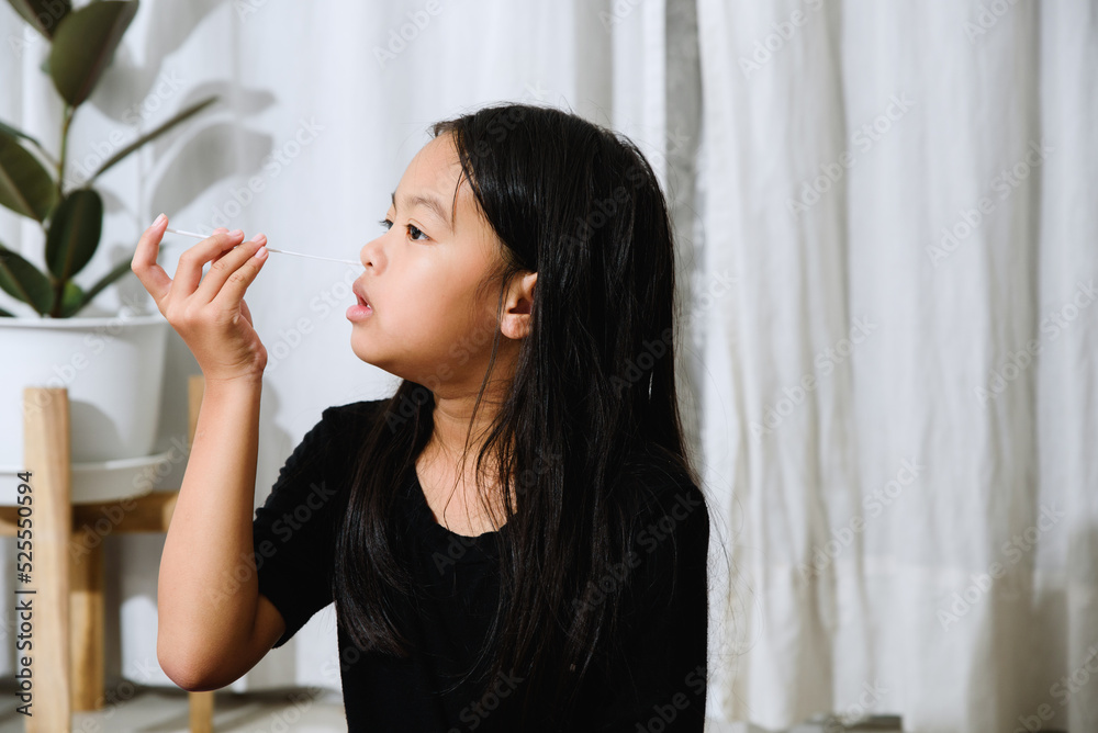 Asian girl preteen girl getting swab test at home, Covid quick rapid ...