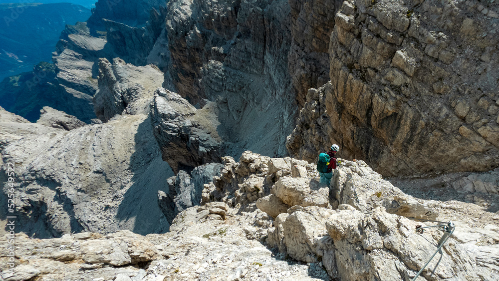 climbing the via ferrata "via delle bocchette" mountain sign in the ...