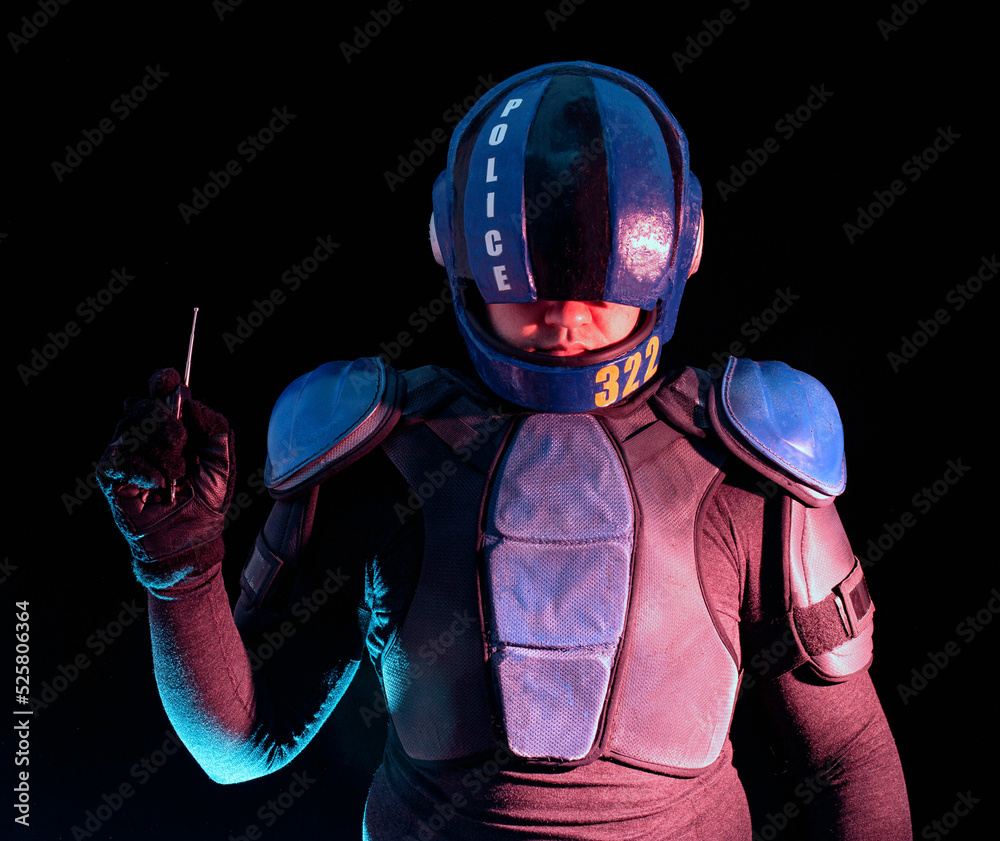Cyberpunk concept, world of the future. Police officer in the dark ...