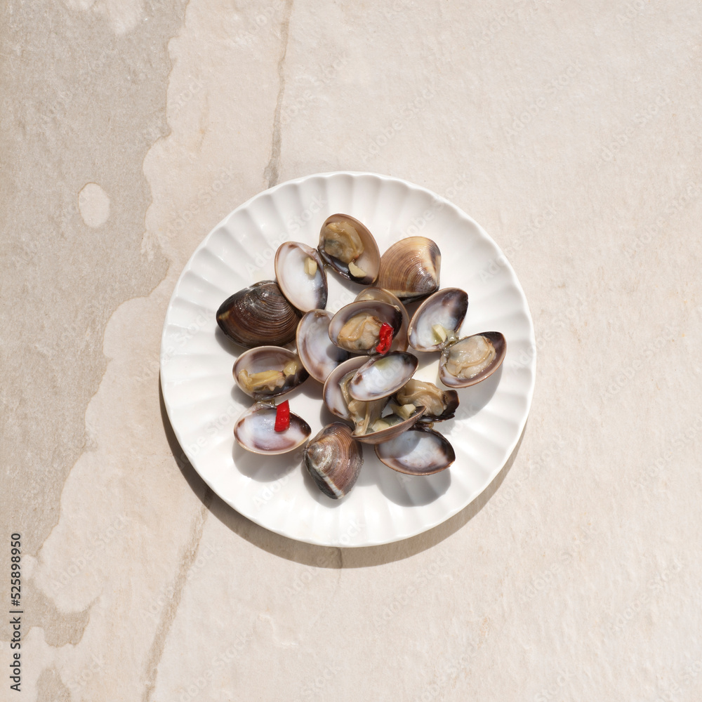 Delicious Clams (Venus clams or vongole) aesthetic dish, stone warm ...
