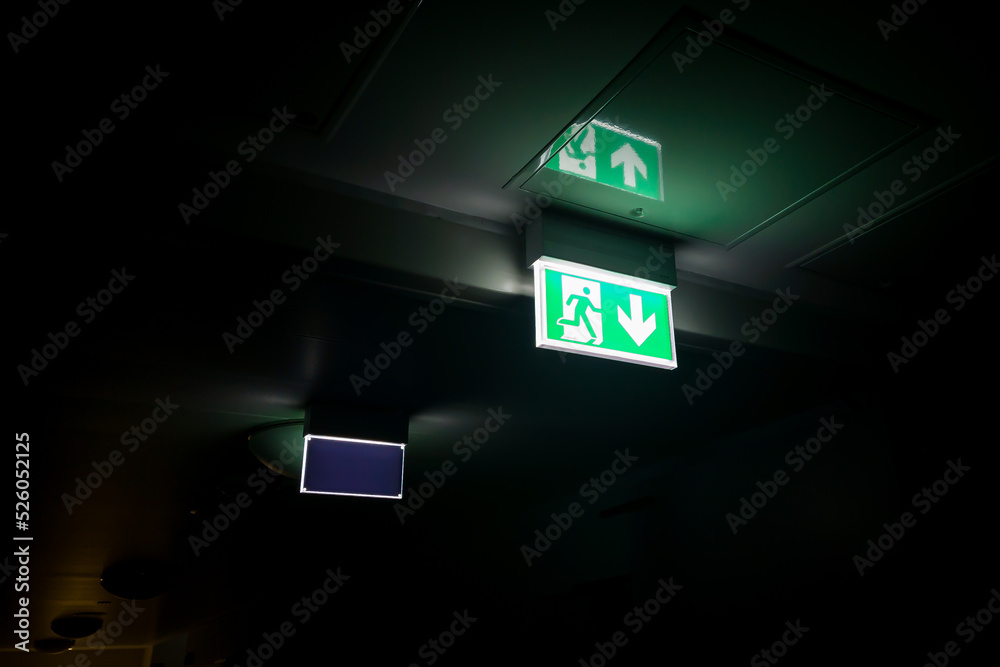 Illuminated evacuation board, safety sign in the corridor. safety and ...