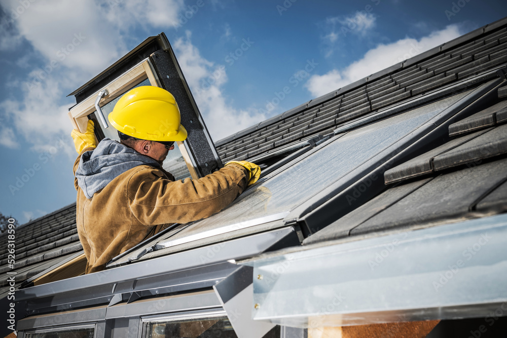 Worker Repairing the Roof Window Stock Photo | Adobe Stock