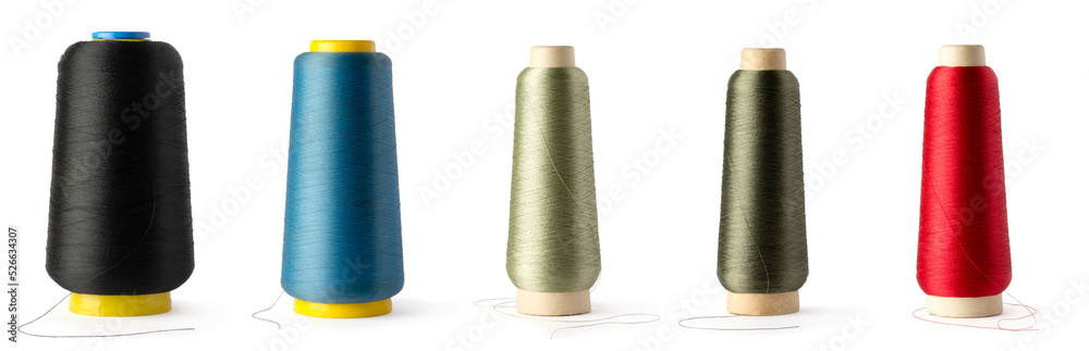 spool of colorful color sewing thread used in fabric and textile ...