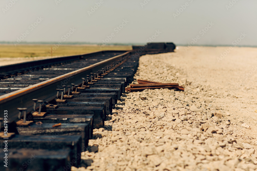 Laying of new railway tracks with wooden sleepers laid on groundwork ...