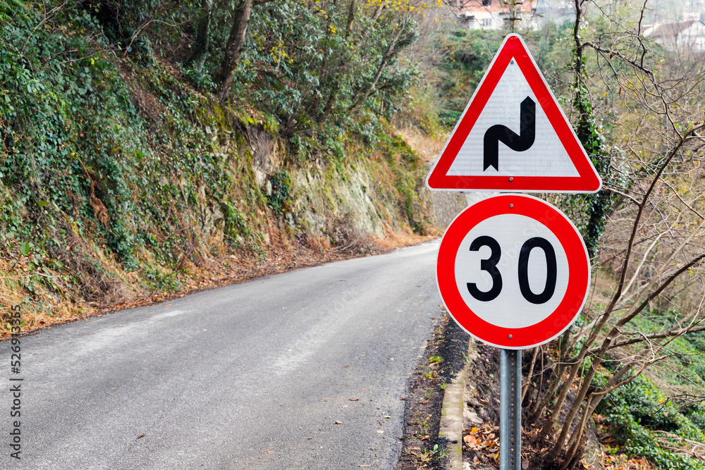 Dangerous turns and speed limit road signs Stock Photo | Adobe Stock