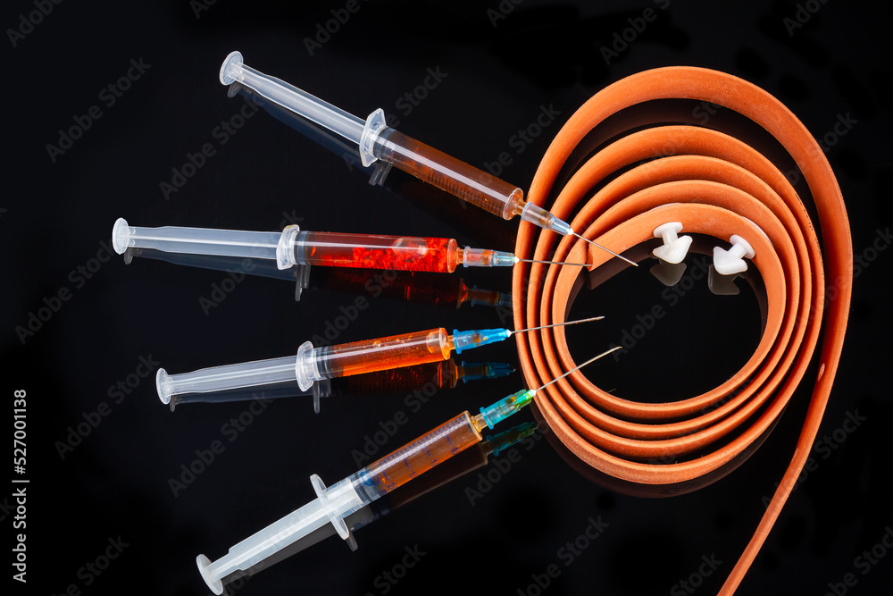 Syringes with drugs and tourniquet top view flat lay. Drug addiction ...