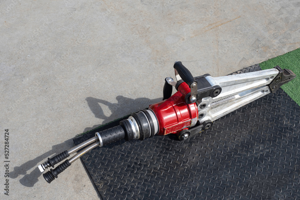 Expander hydraulic. Rescue equipment. Hydraulic expander lies on ground ...