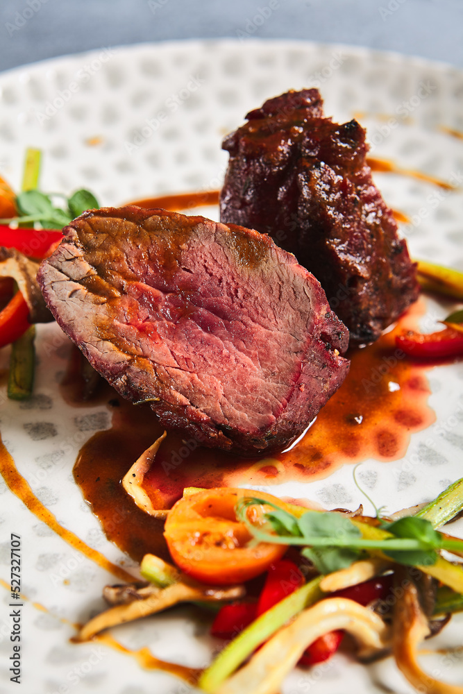 Roasted Beef fillet with vegetables. Roasted Mignon steak with paprika ...