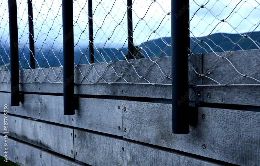 Terrace fencing, railings of metal pipes filled with steel cables cable ...